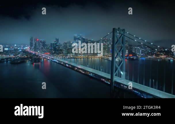 Night time lapse cars traffic driving across Bay Bridge to San ...