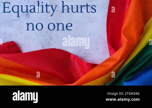 4k zoom in out Rainbow flag with text EQUALITY HURTS NO ONE message ...