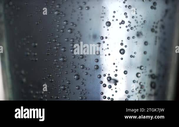 Macro sparkling Bubbles on glass. Carbonated soft drink. Water bubbling ...