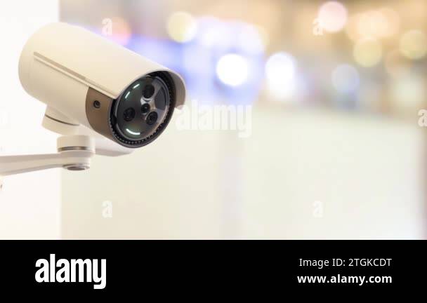 CCTV camera installed on wall of the building. Scan the area for ...