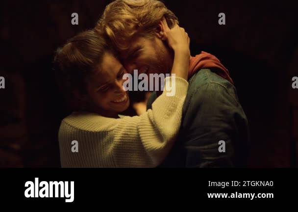 Smiling lovers dance on date night closeup. Close up loving couple have ...