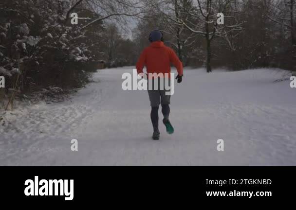 Wrong outfit and footwear for running on slippery surfaces in winter ...