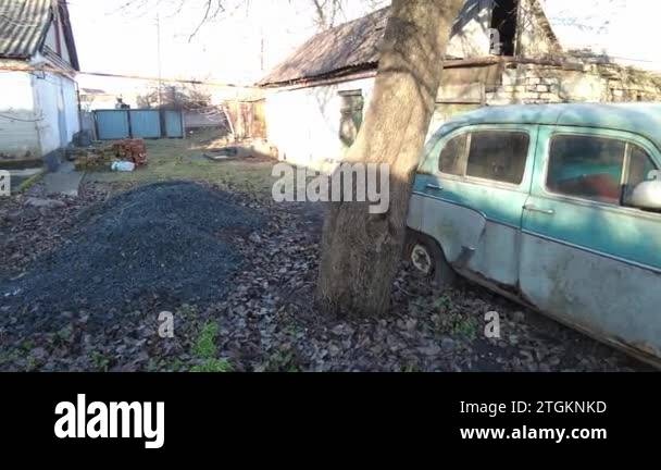 abandoned house in Ukraine. Rubbish in the yard. destroyed house ...