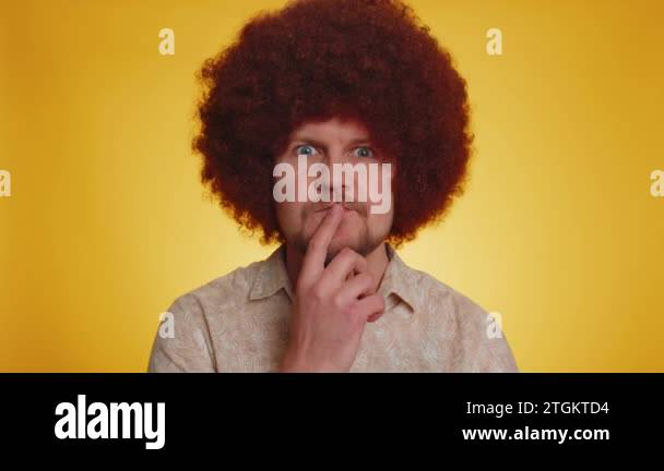 Excited amazed man with lush Afro hairstyle coiffure in touching head ...