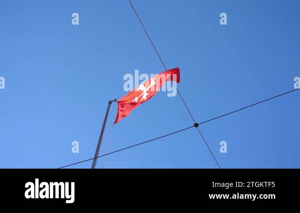 Pisan Cross on Flag flying on Leaning tower of Pisa. Coat of arms of ...