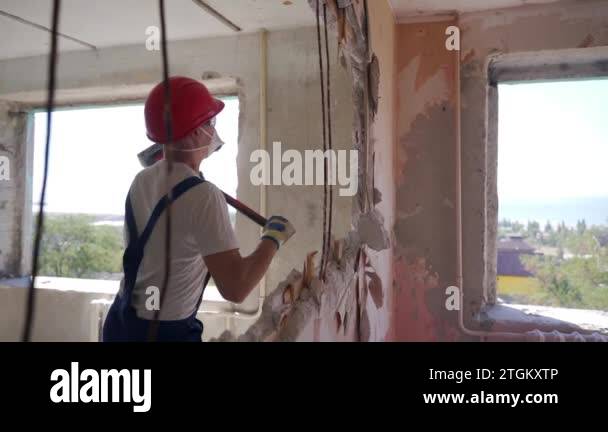Contractor wrecks wall with sledgehammer making hole for rearrangement ...