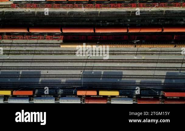 Cargo trains close-up. Aerial view of colorful freight trains on the ...