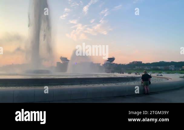 The water fountain with a beautiful sunset view and dramatic sky at the ...