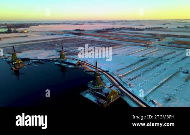 snow covered windmill village in the Zaanse Schans Netherlands during ...