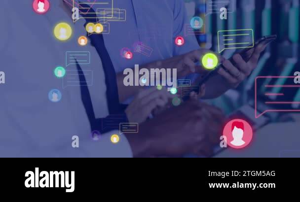 Animation of social media icons and data processing over business people using computers. Global ...