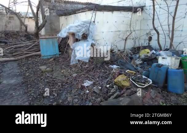 abandoned house in Ukraine. Rubbish in the yard. destroyed house ...
