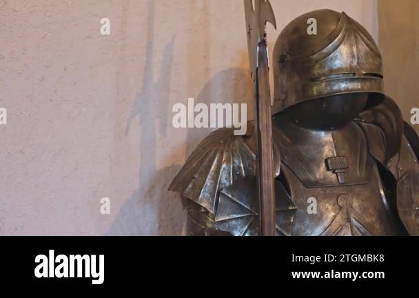 Copper vintage knight armor with a spear from the medieval era in ...