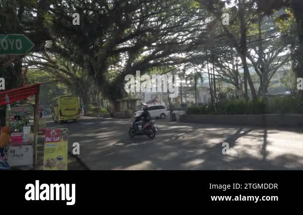 Malang, Indonesia, -23 June, 2022 : a large passenger bus crosses a ...