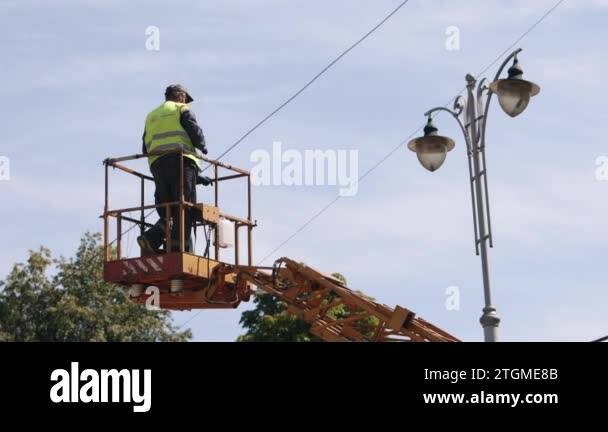 repair street lamp, crane lifted, light bulb. Street light repair work ...