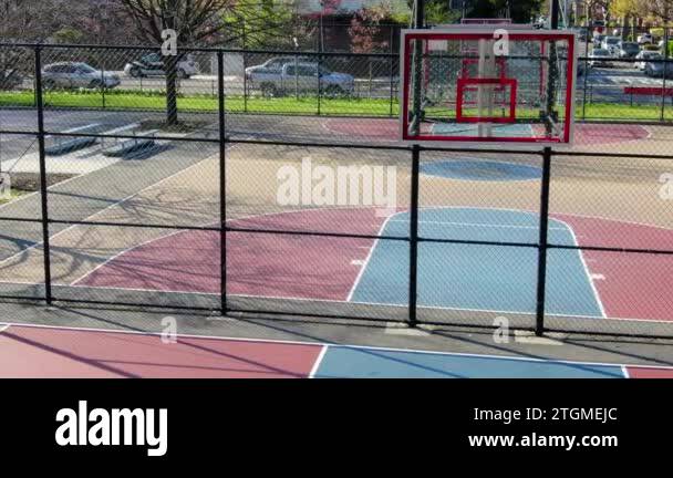 This video shows views of an empty basketball court with rims removed ...
