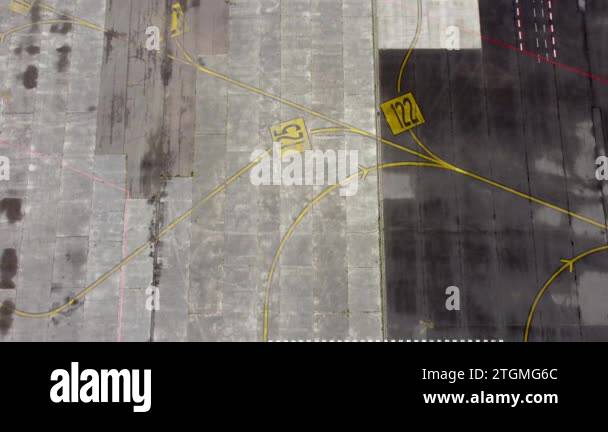 Directional sign markings on the tarmac of runway at commercial airport ...