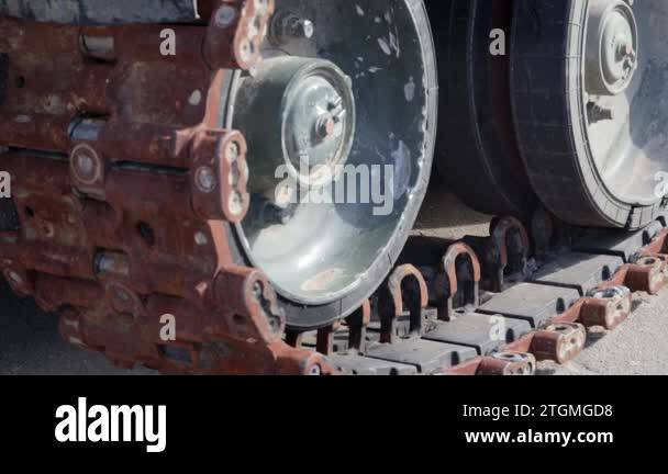 Rusty broken tracks with track rollers of a wrecked tank. Russian ...