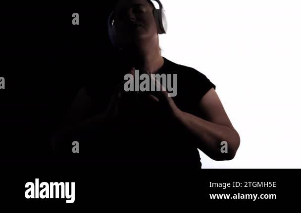 Stereo music. Vibing woman. Silhouette portrait. Excited female ...
