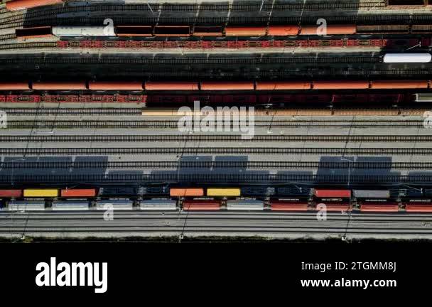 Cargo trains close-up. Aerial view of colorful freight trains on the ...