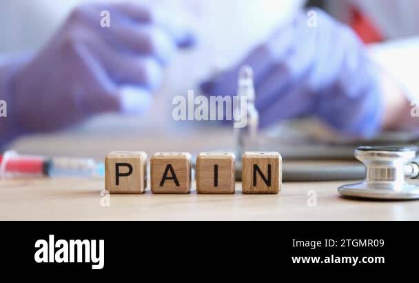 Text pain on background of doctor with syringe with needle in clinic ...