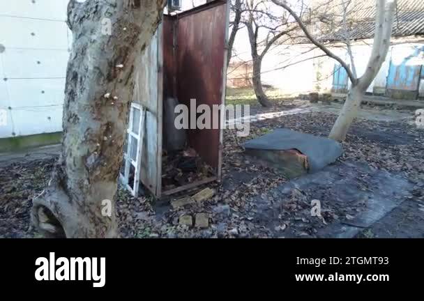 abandoned house in Ukraine. Rubbish in the yard. destroyed house ...