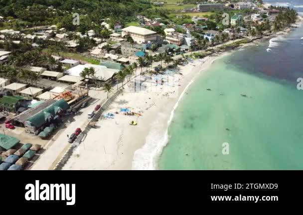 An aerial view of the waves of Bangui Bay crashing into the Pagudpud ...