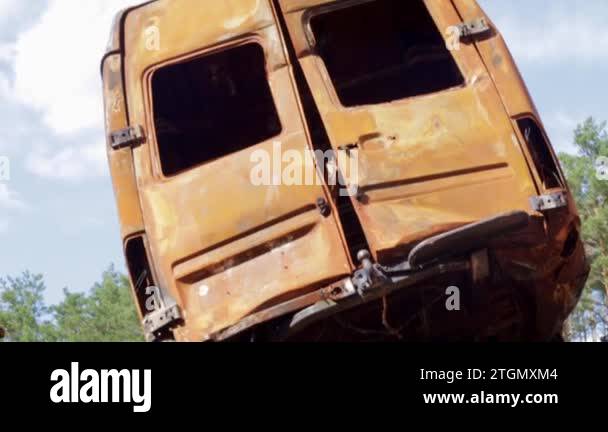 Burnt car body, riddled with bullets. War of Russia against Ukraine ...