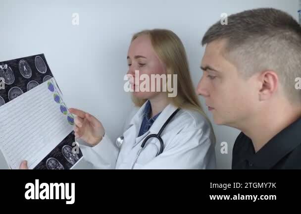 Epileptologist examines patient MRI and electroencephalogram. Concept ...