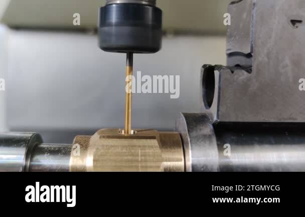 Process of vertical drilling in modern 4-axis CNC milling machine Stock ...