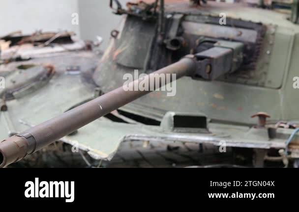 War in Ukraine. Destroyed tank with a torn off turret with a V on it ...