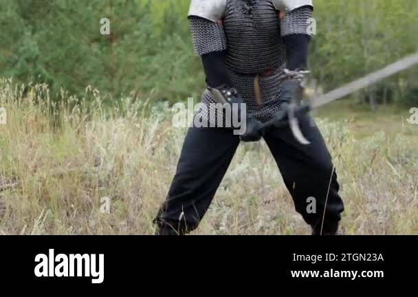 A medieval warrior with gray hair and a scar on his face in chain mail ...