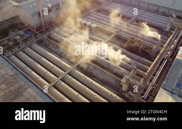 Focus on toxic fumes spread from the roof of an industrial plant ...