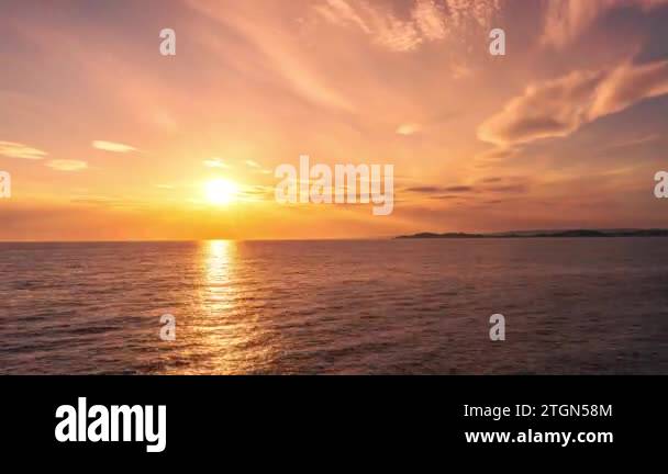 Sunsetting over the water Stock Videos & Footage - HD and 4K Video Clips - Alamy
