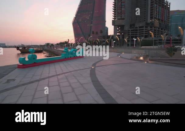 Doha corniche in Doha, Qatar zooming in sunset shot showing the ...