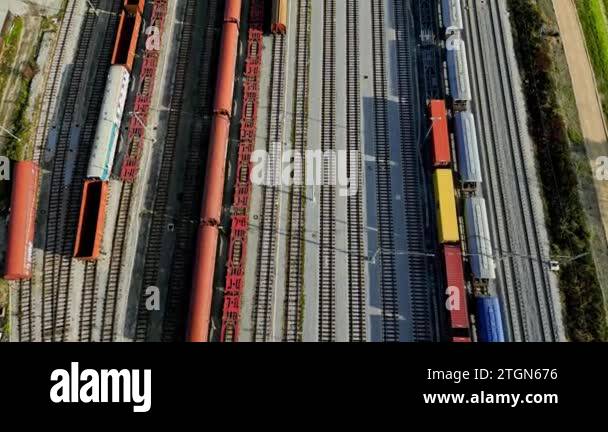 Cargo trains close-up. Aerial view of colorful freight trains on the ...