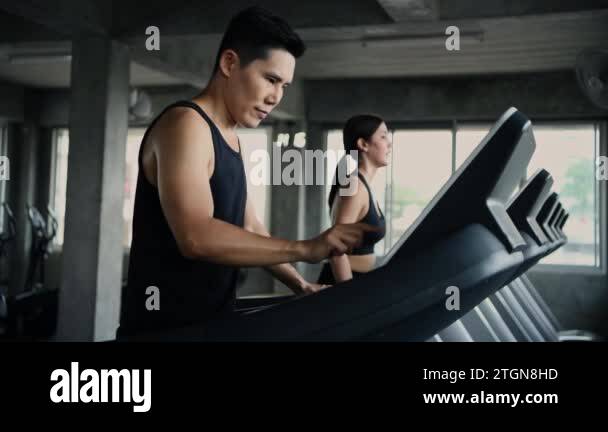 Fitness concept of 4k Resolution. An athlete running on a treadmill in ...