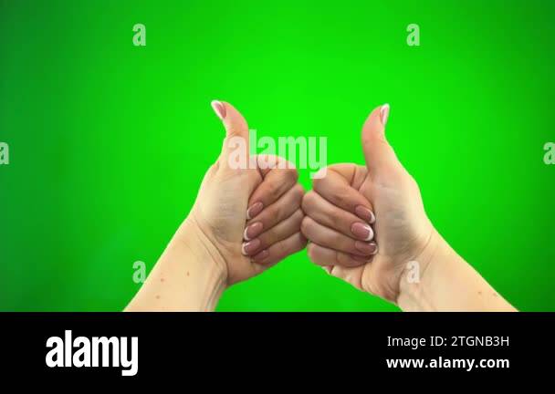 female hands with french manicure on green screen approving thumbs up ...
