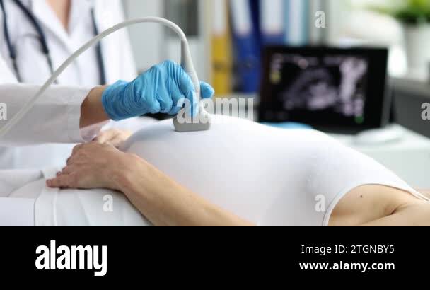 Ultrasound scanner device in hands of professional doctor examining ...