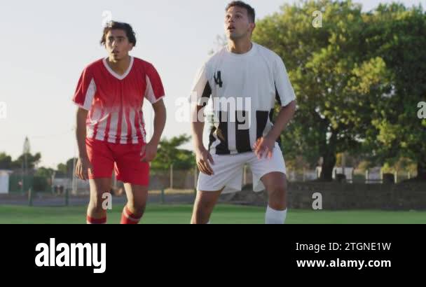 Video of two diverse male football players playing football. Male ...