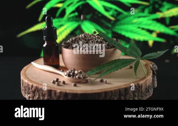 Cannabis seeds falling into and bouncing on heap of marijuana seed in ...