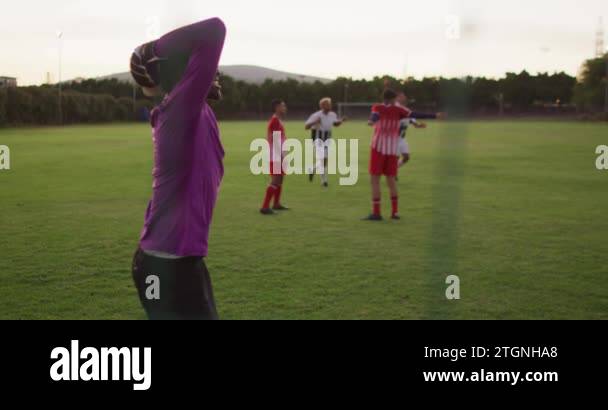 Video of diverse gorup of male football players on field,playing ...