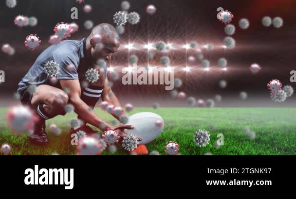 Animation of virus cells over biracial male rugby player at stadium ...