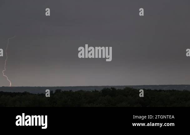 Lightning flash in storm clouds. Heavy clouds bring multiple flashes of ...