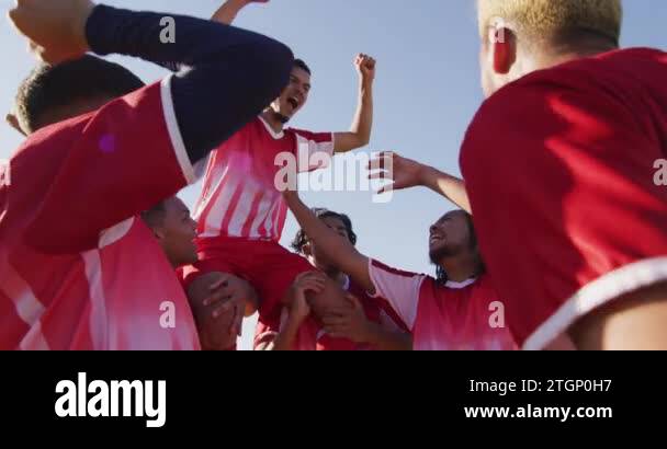 Video of happy diverse group of male football players wining. Male ...