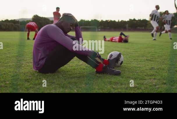 Video of diverse group of male football player on field, playing ...