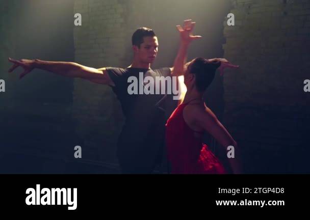 Close-up ballroom dancers dancing passionate tango eye to eye ...