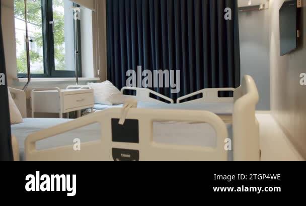 Two empty bed in a hospital room with medical equipment. Cozy room in ...