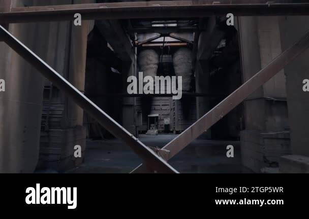 Dark scary interior of an old destroyed warehouse of a coal power plant ...