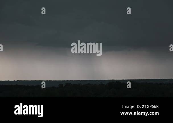 Lightning flash in storm clouds. Heavy clouds bring multiple flashes of ...