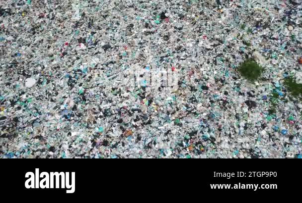 Shooting from the height of a pile of garbage, a large garbage dump of ...